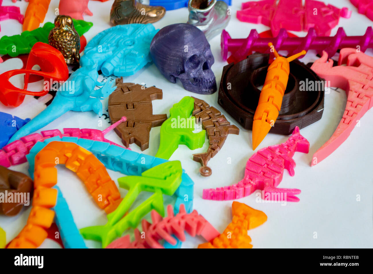 Models printed by 3d printer. Bright colorful objects printed on a 3d ...
