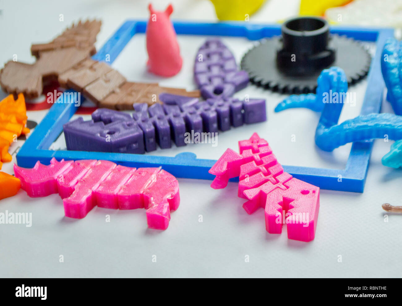 Models printed by 3d printer. Bright colorful objects printed on a 3d ...