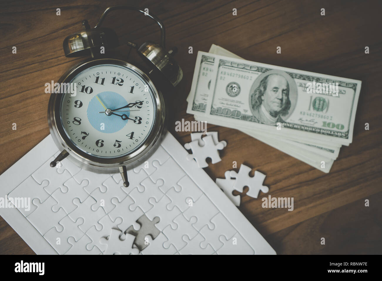 Jigsaw puzzle piece clock hi-res stock photography and images - Alamy