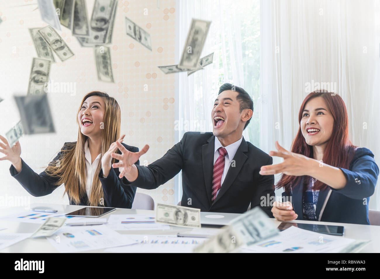 Business team is throwing money for business finacial success concept ...