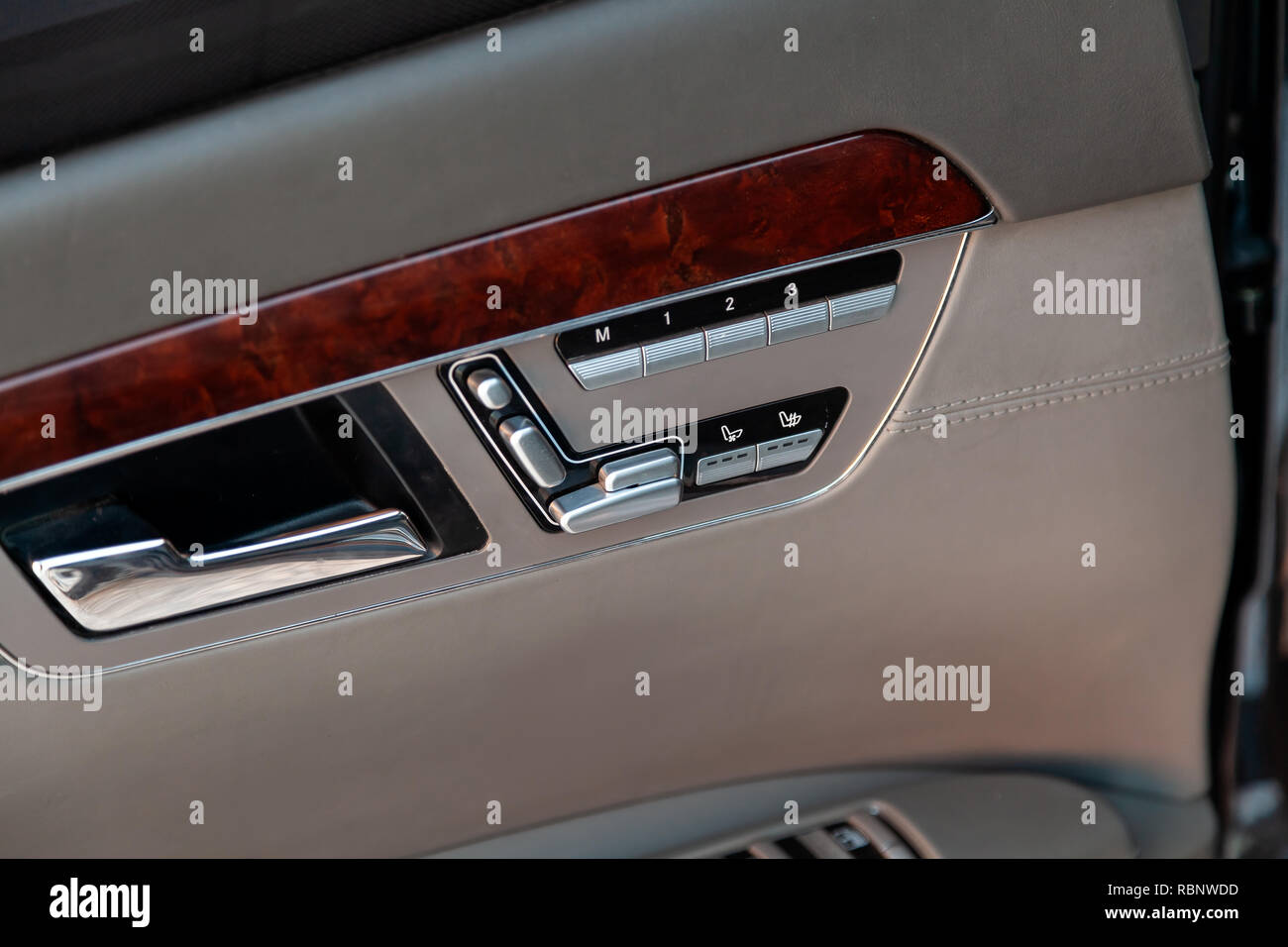 Automatic seat memory buttons on the passenger door panel upholstered ...