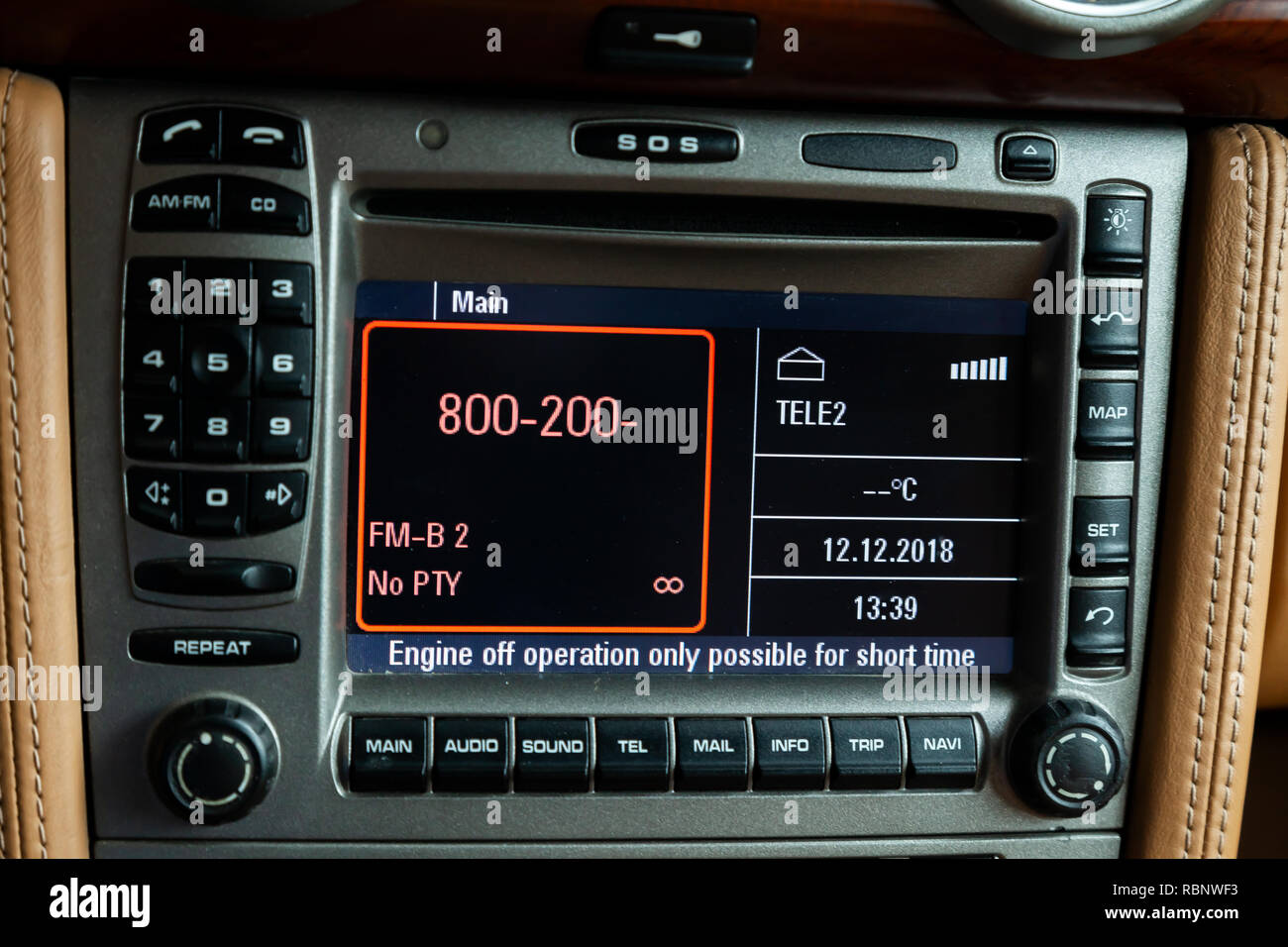 The central control panel of black color with buttons and with red ...