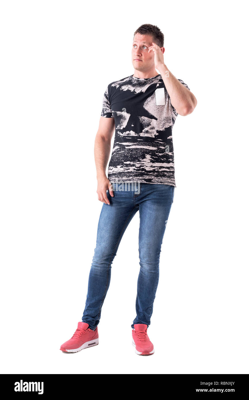 Confused young adult casual man scratching head and looking up ...