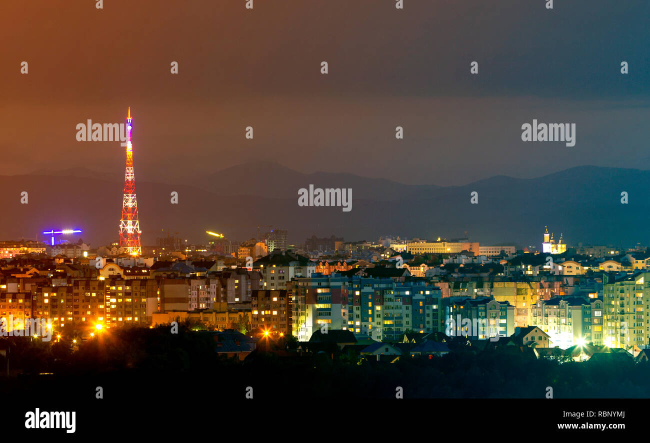 Wide panorama, aerial night view of modern tourist Ivano-Frankivsk city ...
