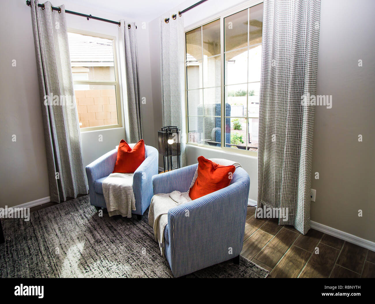 Sitting Area With Two Barrel Chairs Stock Photo - Alamy