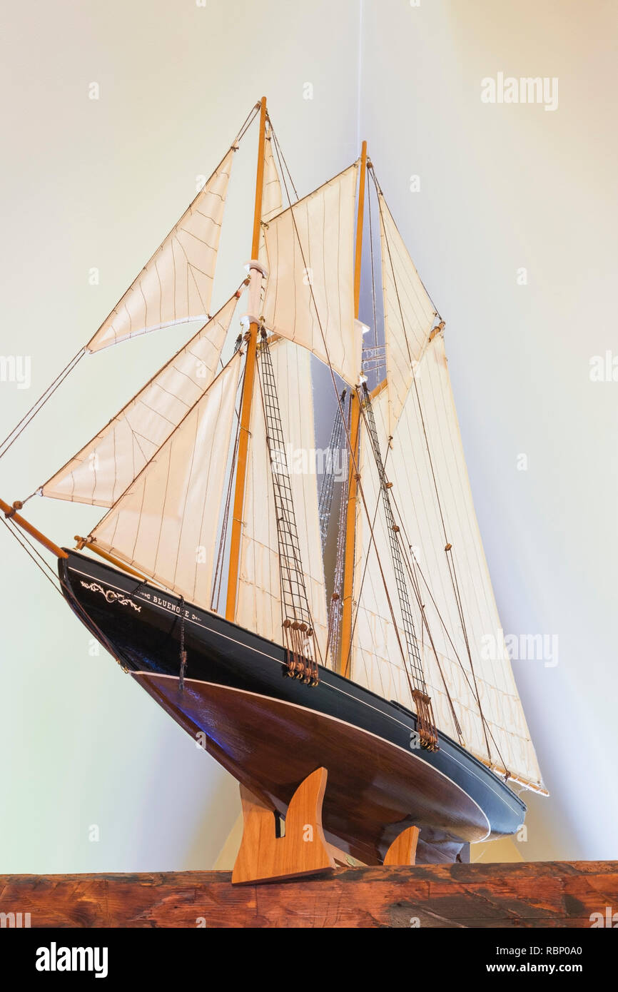 Wooden scale model of the Bluenose schooner displayed on a wooden beam ...