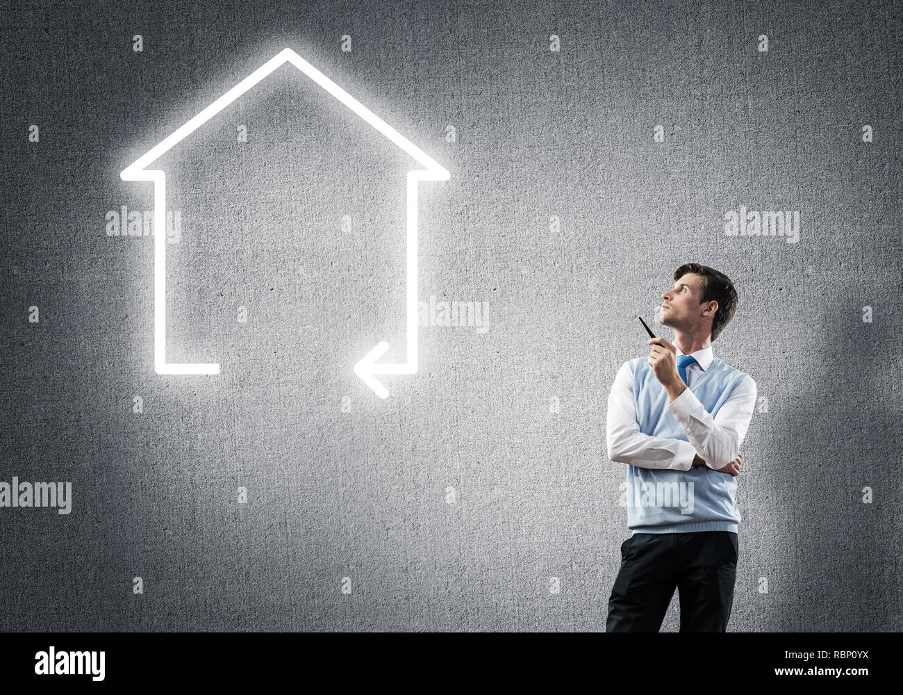 Elegant banker wearing red tie and house sign as banking concept Stock ...
