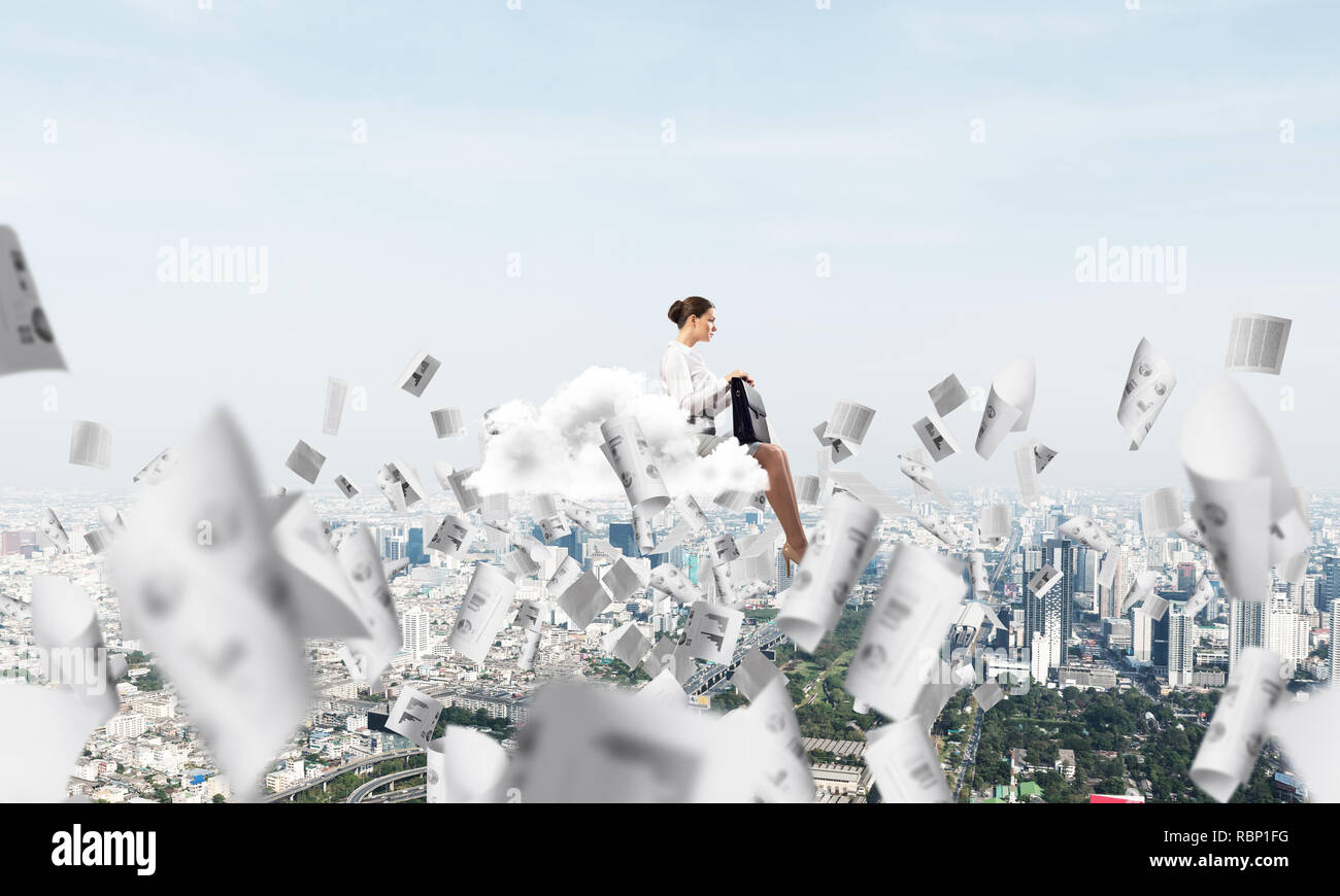 Woman float above city on cloud and papers flying around Stock Photo ...