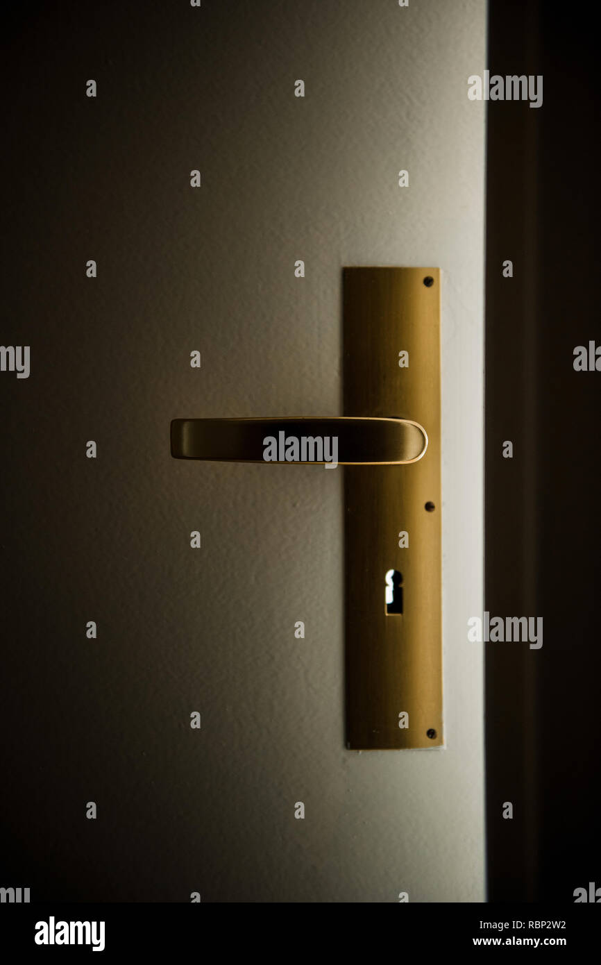 Cinematic opened door with light passing through keyhole - hope, future ...