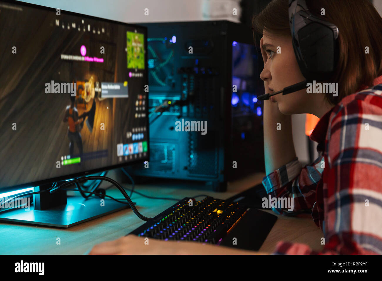 Nervous angry young woman gamer playing online computer games at the ...