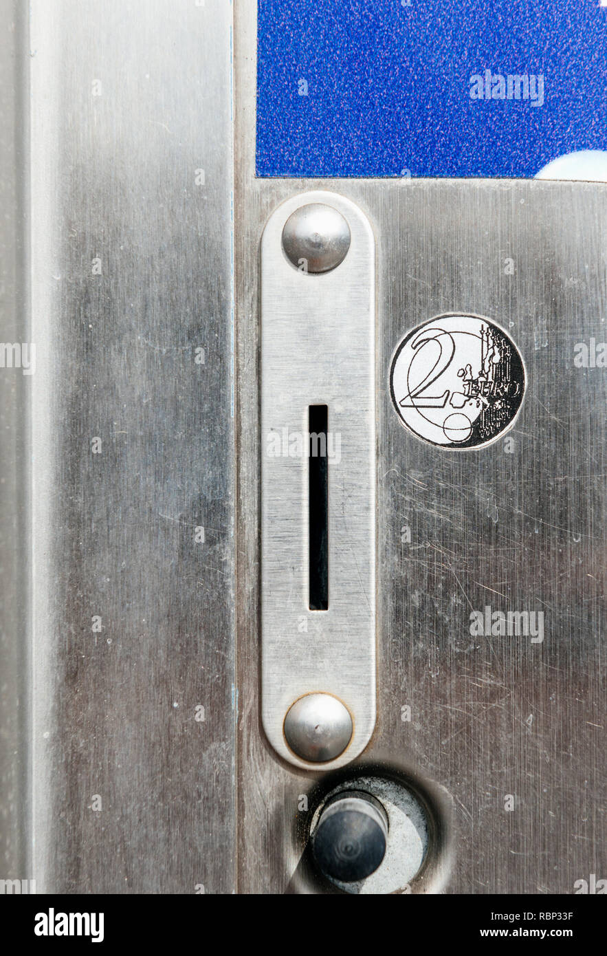 Insert coin hole on the steel wall at the car-wash station with two ...