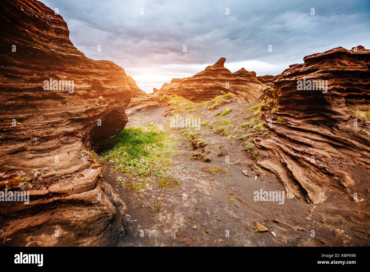 Red sandy rock with by magma formed by wind. Popular tourist attraction ...