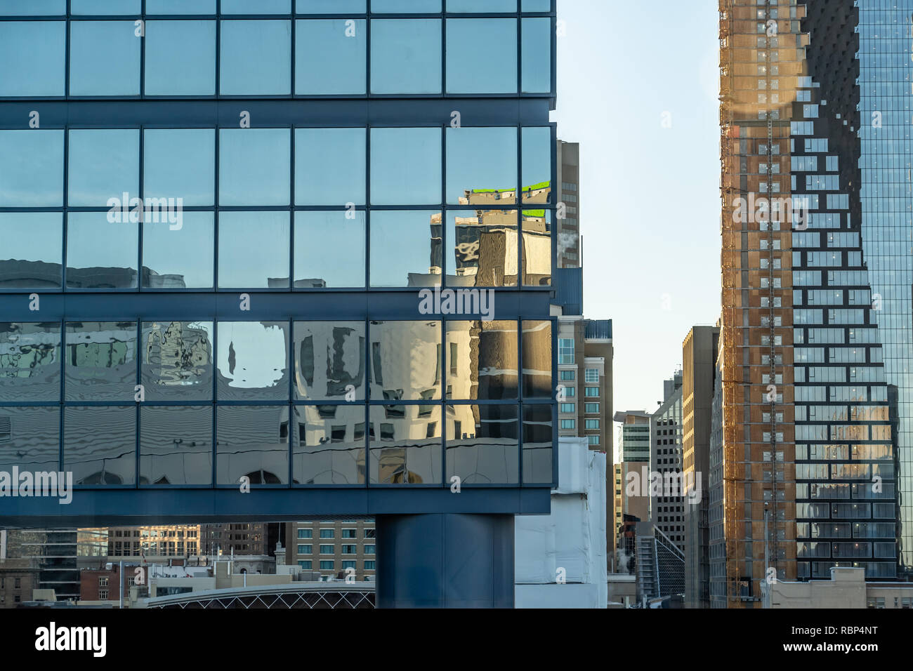 Downtown Calgary skyline reflected in glass tower Stock Photo - Alamy