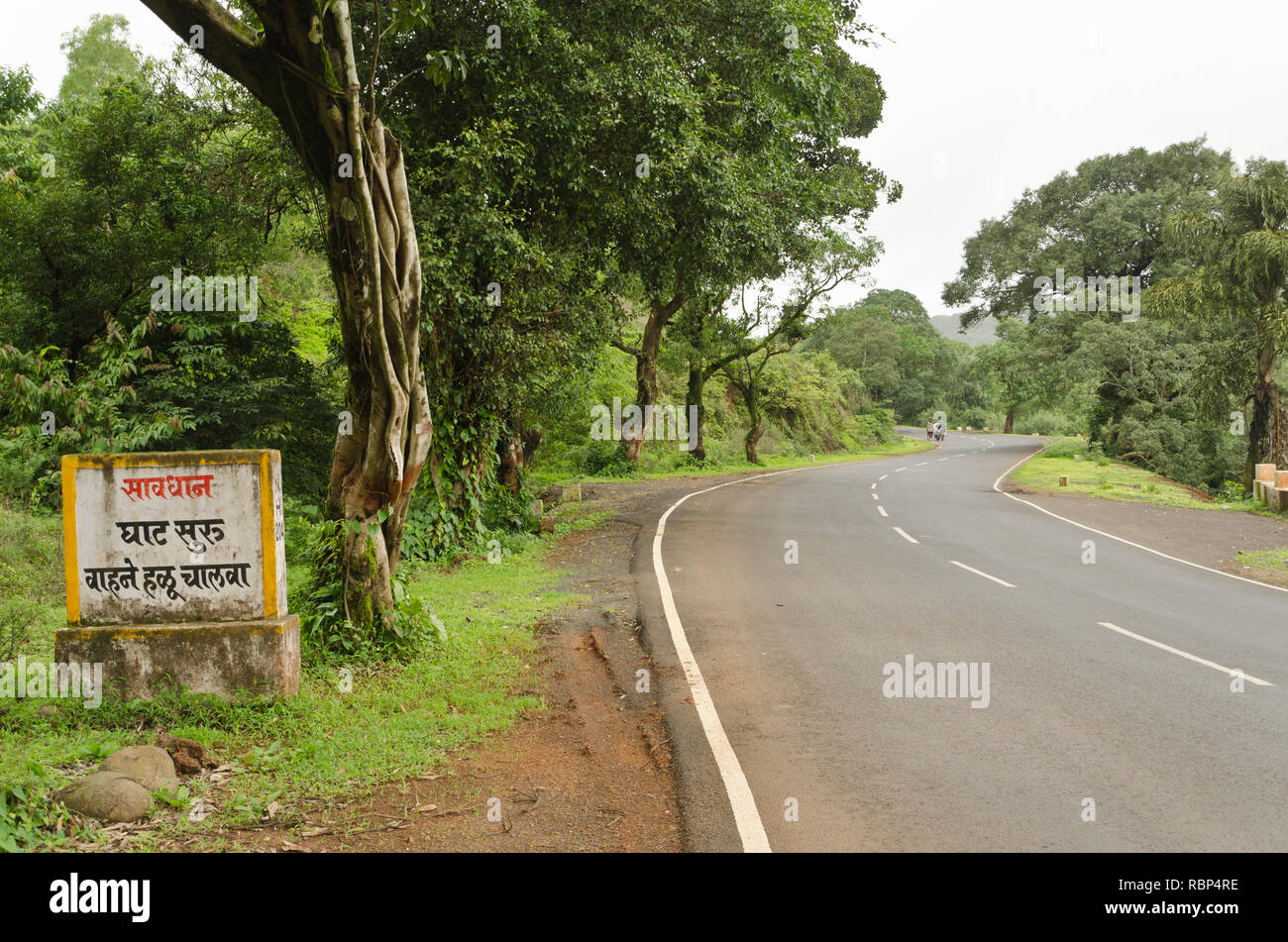 Roadside caution sign, Kolhapur, Maharashtra, India, Asia Stock Photo ...