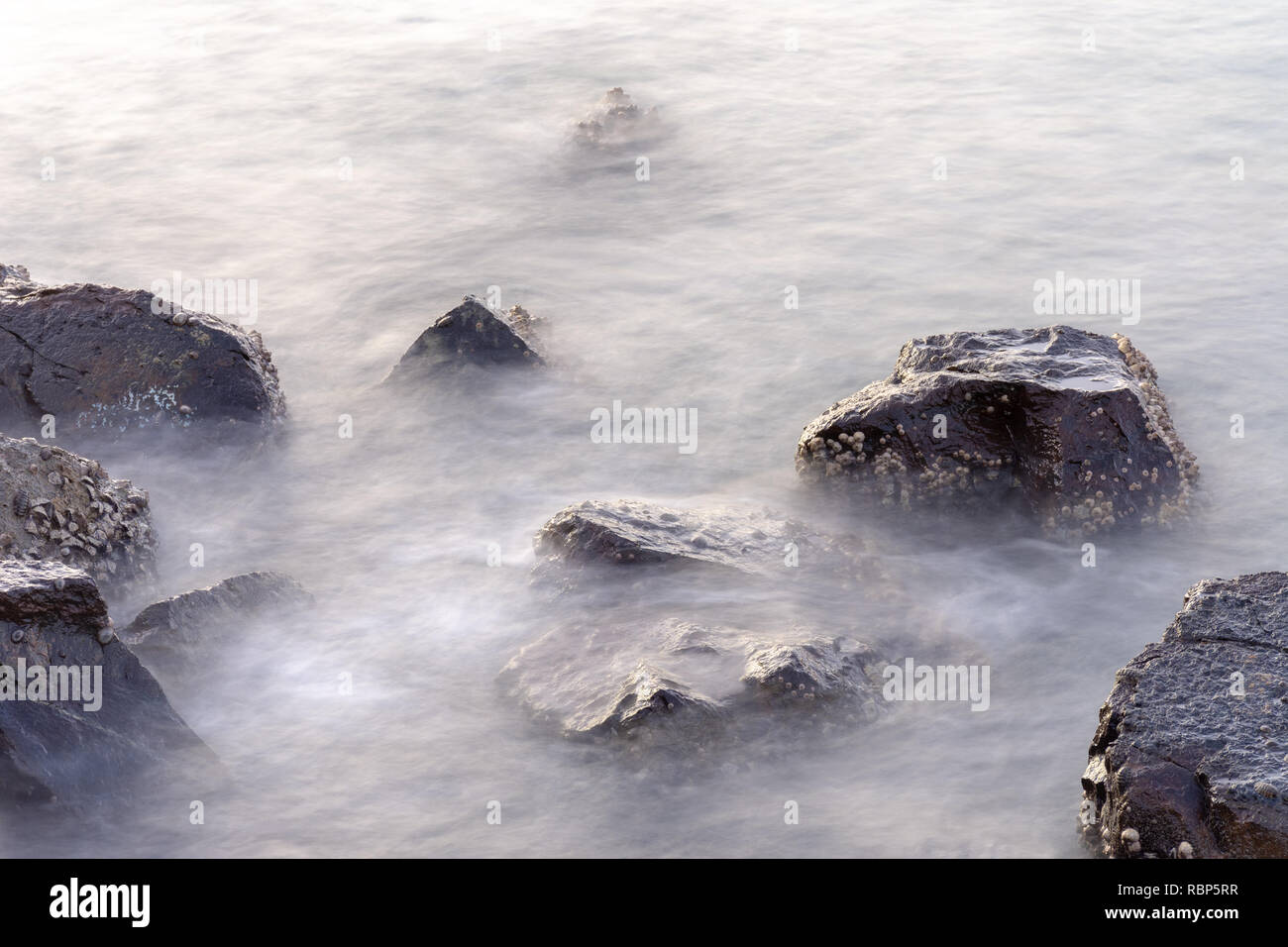 A long exposure in the early evening of the tide coming in off the ...