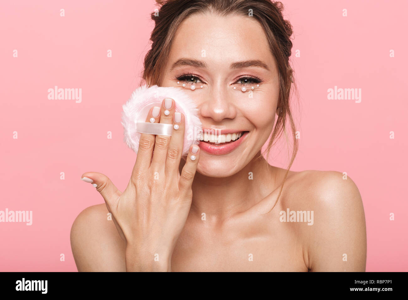 Image of a pretty young woman posing isolated over pink wall background ...