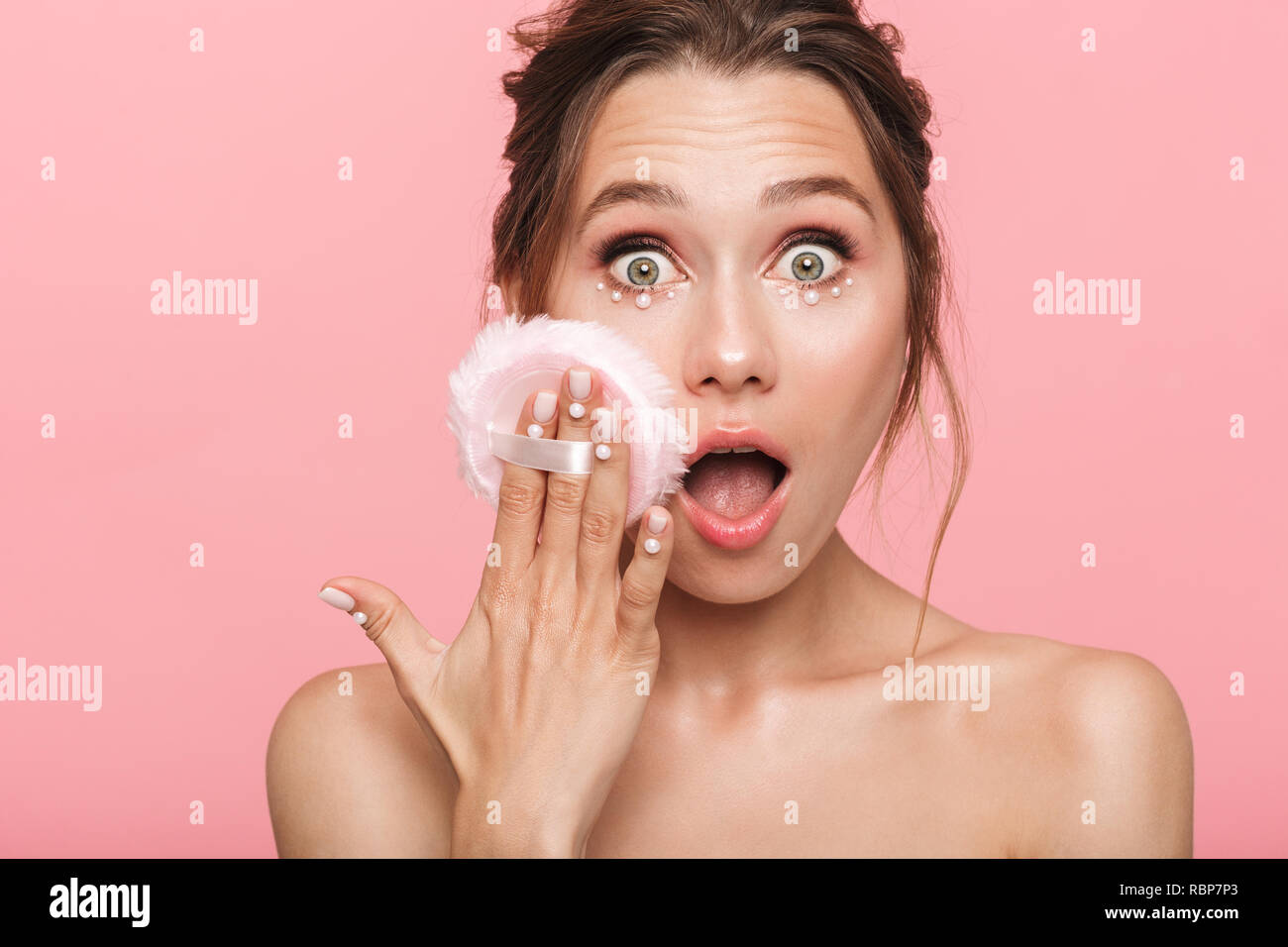 Image of a shocked young woman posing isolated over pink wall ...
