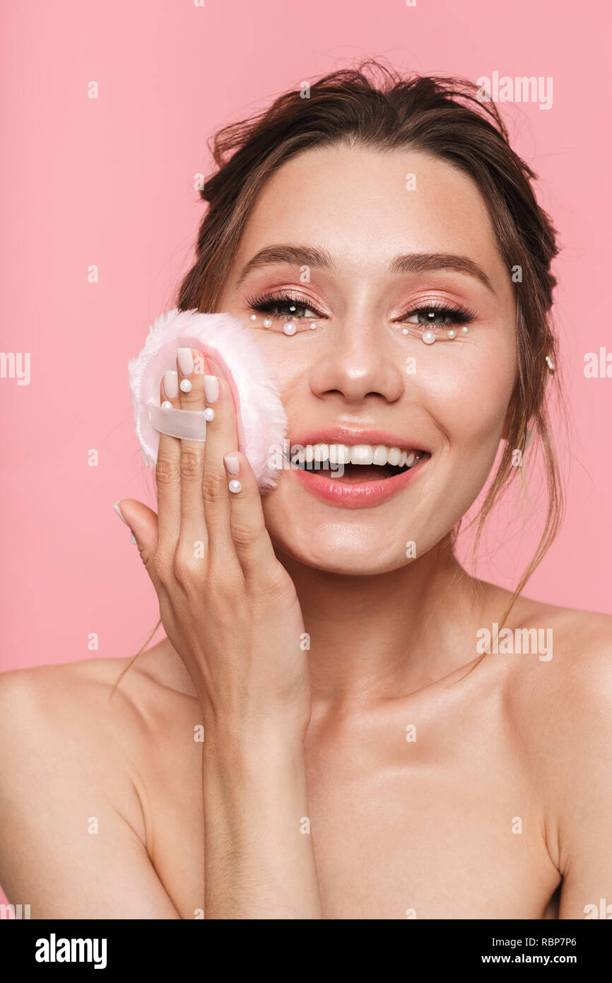 Image of a pretty young woman posing isolated over pink wall background ...