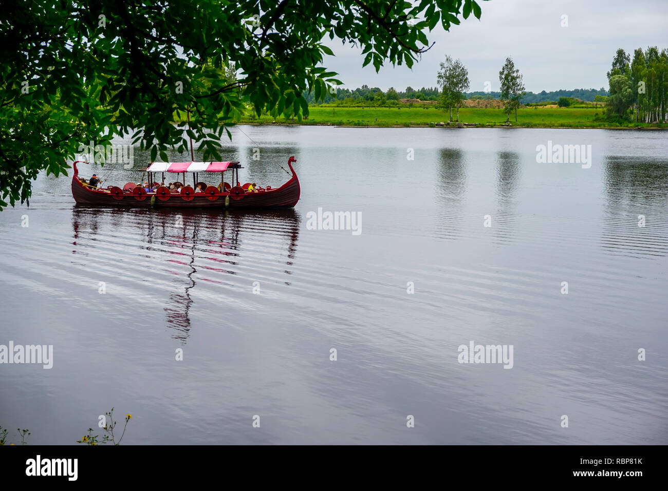 Tourist boat in the style of viking on river Daugava, Latvia. Ancient ...
