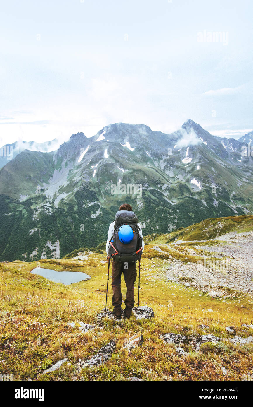 Adventurer hiking in mountains solo traveling adventure lifestyle ...