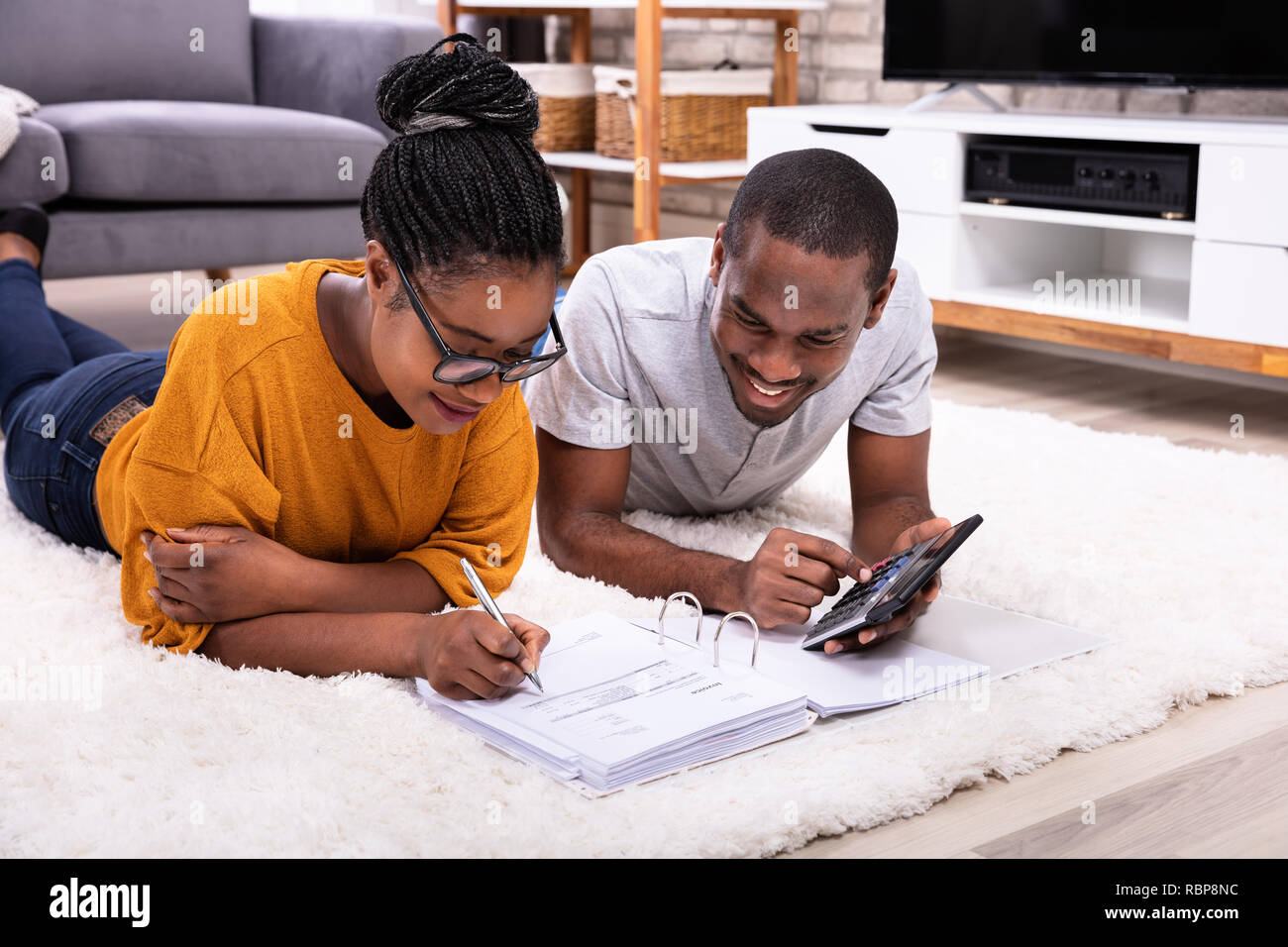 African man counting calculator hi-res stock photography and images - Alamy