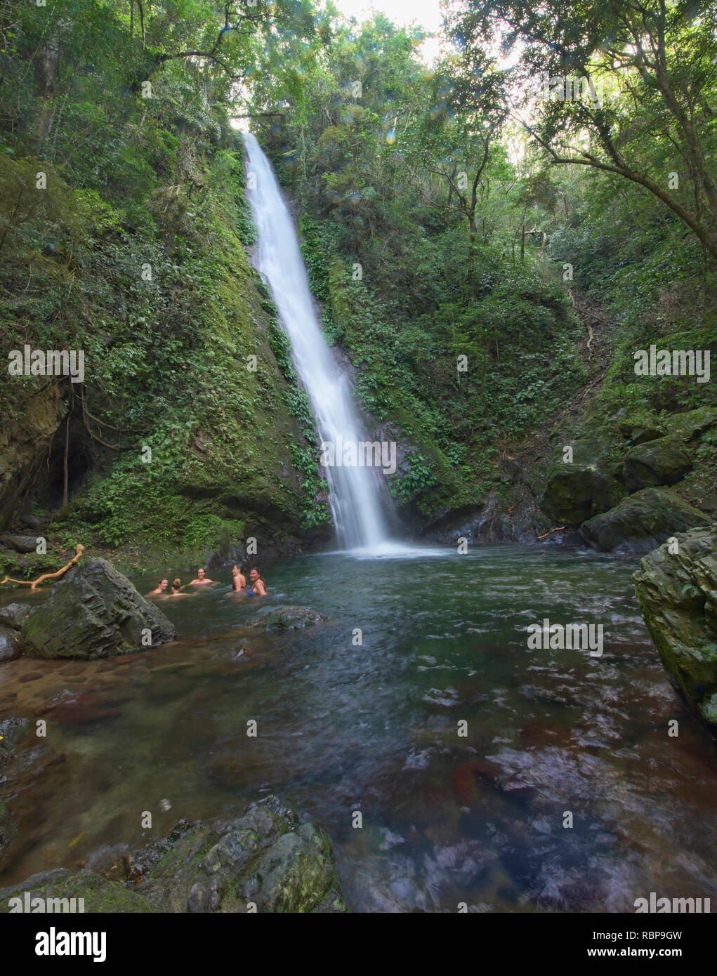 Tourists enjoying beautiful Kabigan Falls, Pagudpud, Luzon, Philippines ...