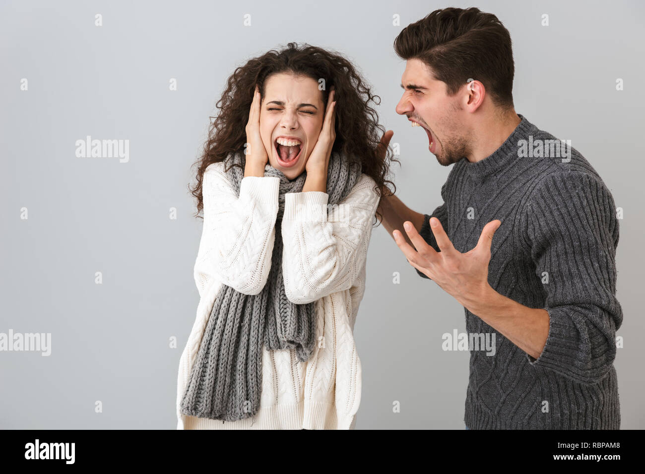 Photo of annoyed man and woman screaming while fighting together ...