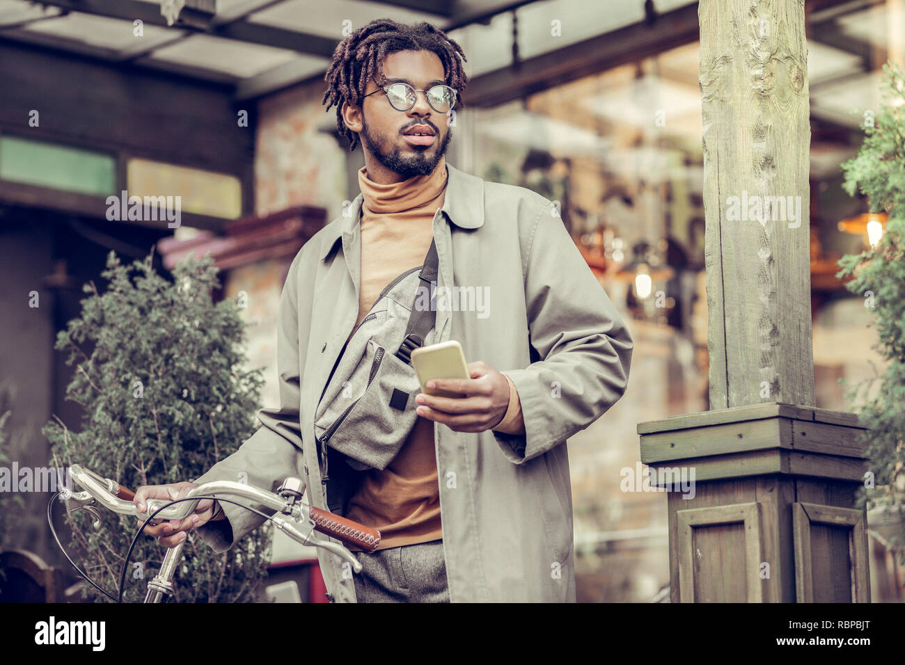 Serious brunette man being deep in thoughts Stock Photo - Alamy