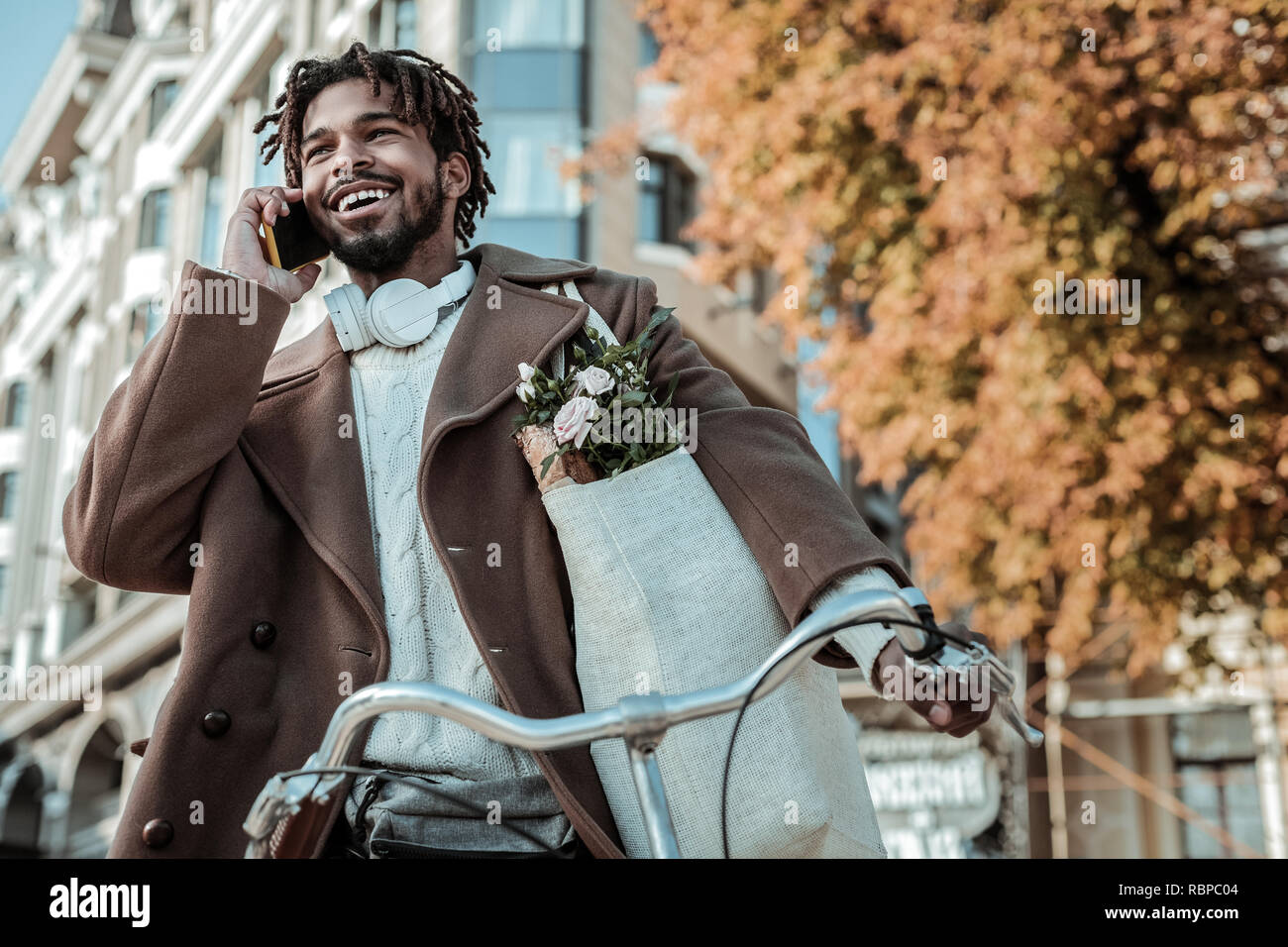 Positive delighted male person talking per telephone Stock Photo - Alamy
