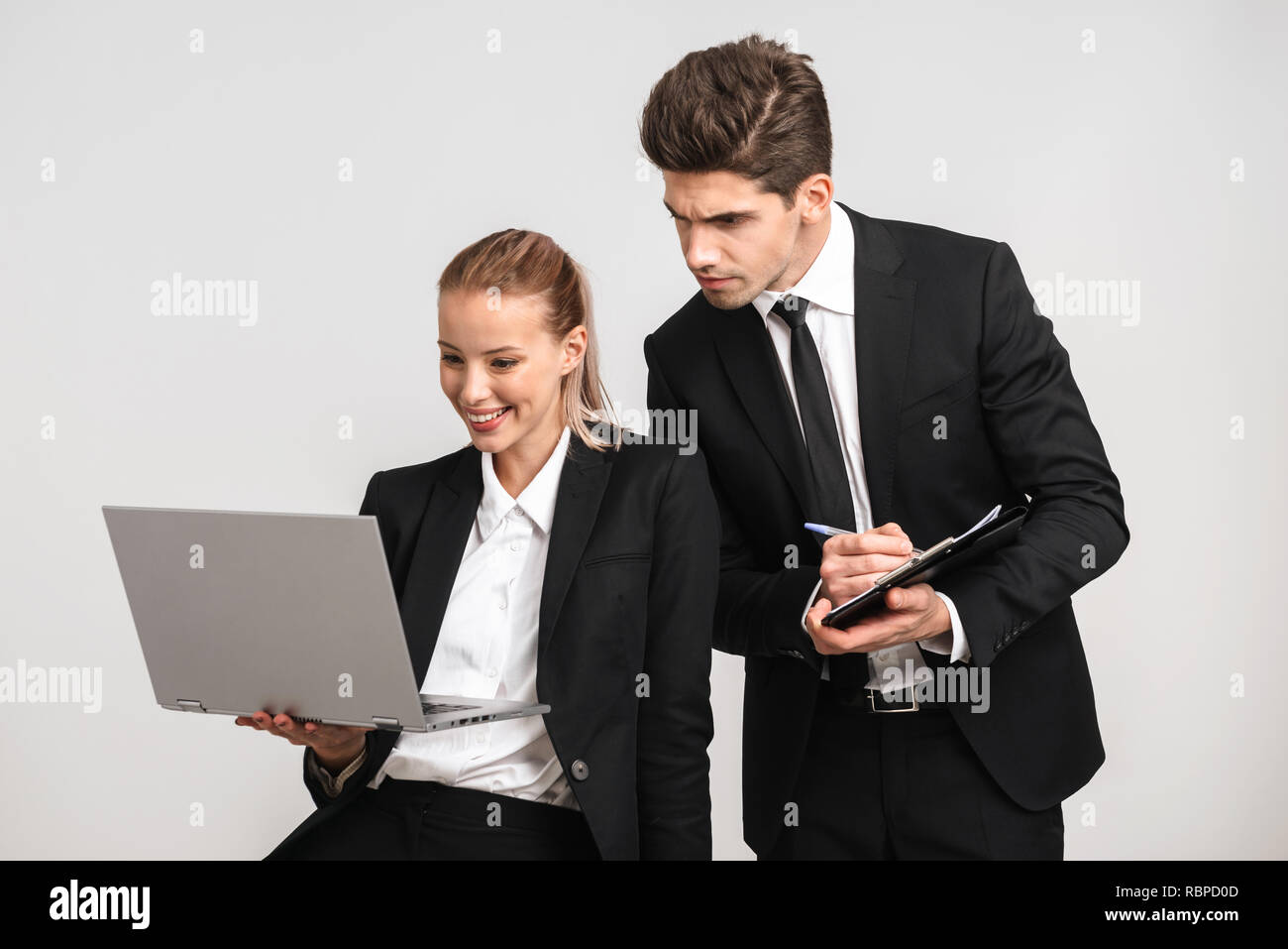 Professional couple suits hi-res stock photography and images - Alamy