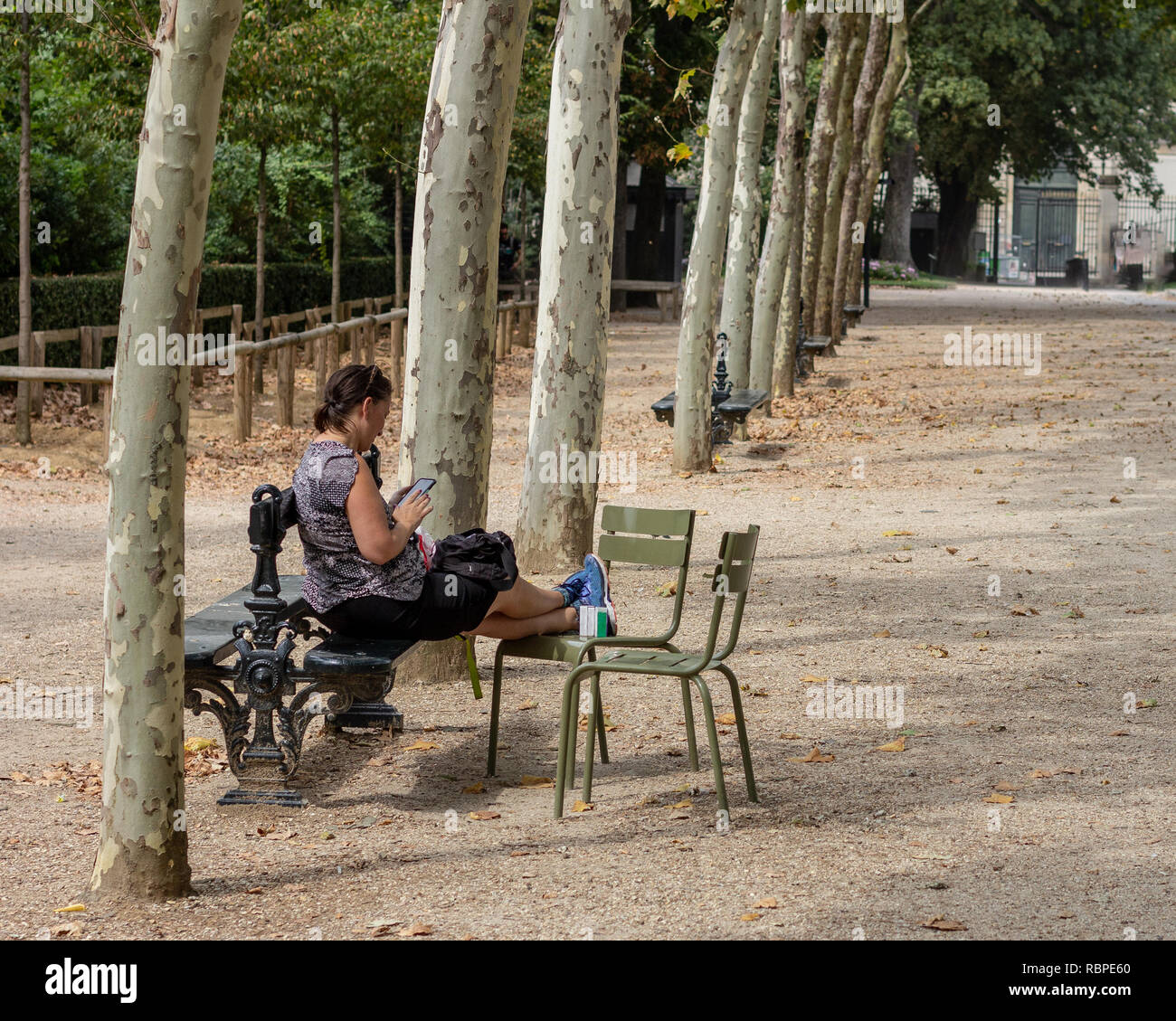 Woman feet up chair outside hi-res stock photography and images - Alamy