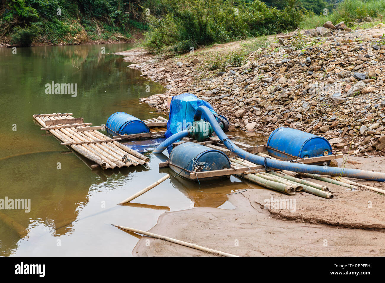 water pump on a bamboo raft Stock Photo - Alamy
