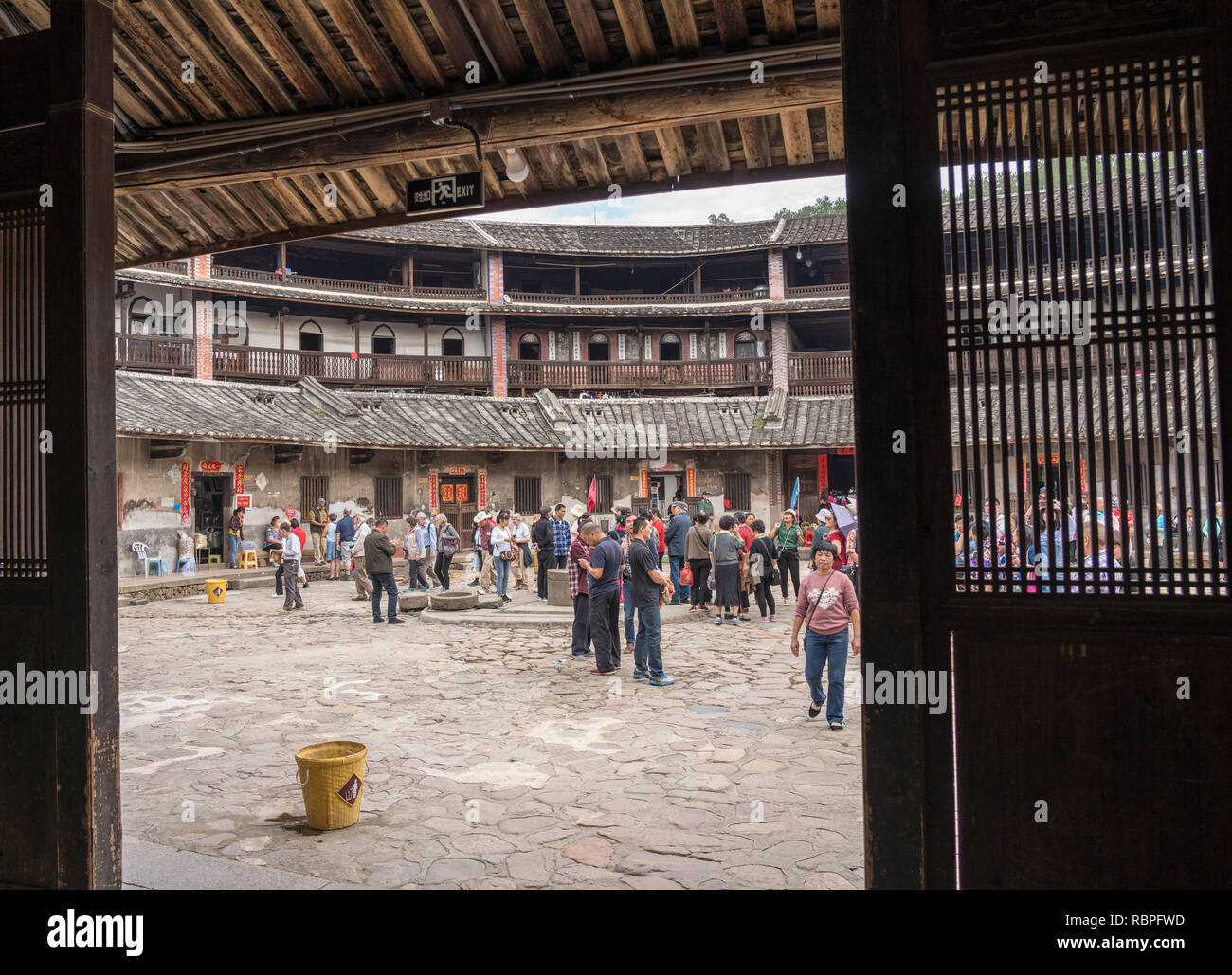 Tourists inside Tulou at Huaan Unesco World Heritage site Stock Photo ...