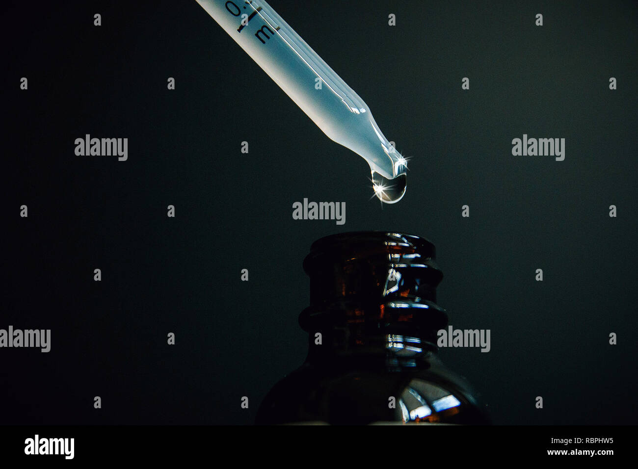 Yellow drop from a pipette hi-res stock photography and images - Alamy