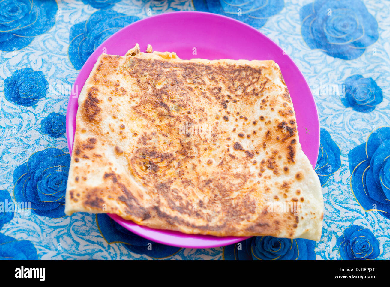 Fresh prepared malaysian roti sardin with fish served in local ...
