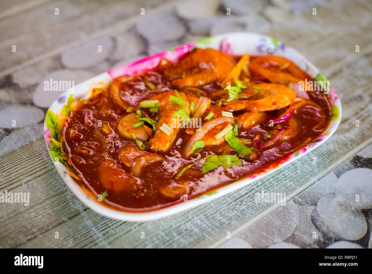 Fresh prepared malaysian sambal udang prawns with sauce served in local ...