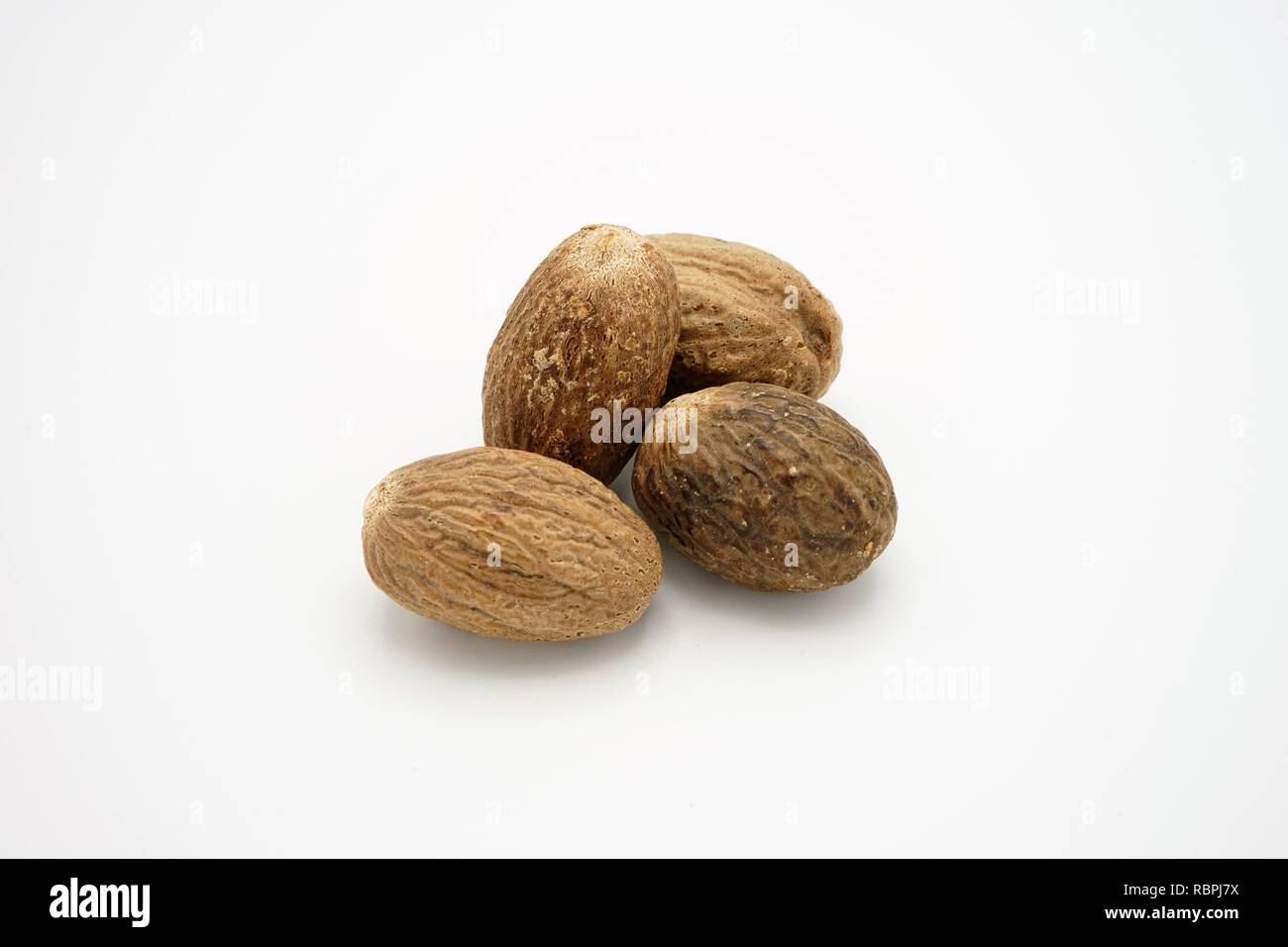 Fresh nutmeg isolated on white background Stock Photo - Alamy