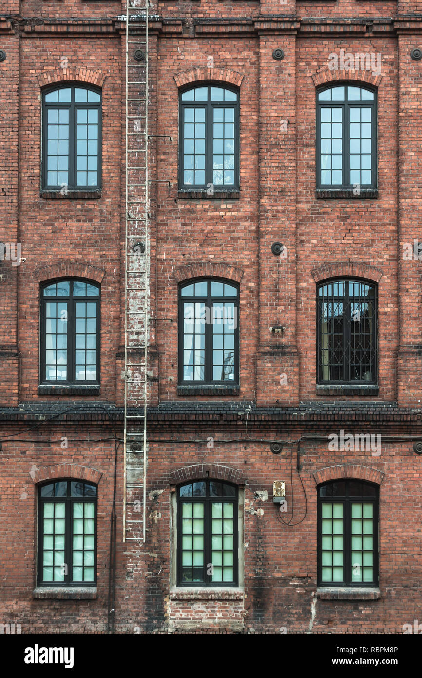 Żyrardów, Poland. Window with iron frame and red bricks wall of old ...