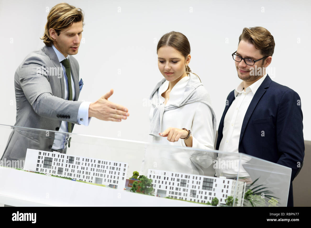 Group of architects sharing ideas in modern office Stock Photo - Alamy