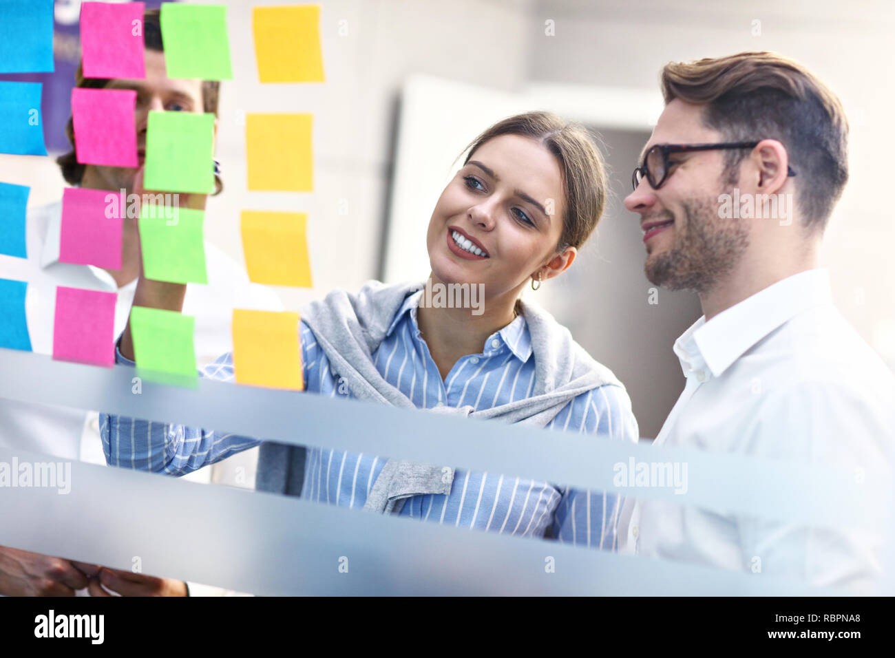 Group of business people sharing ideas in modern office Stock Photo - Alamy