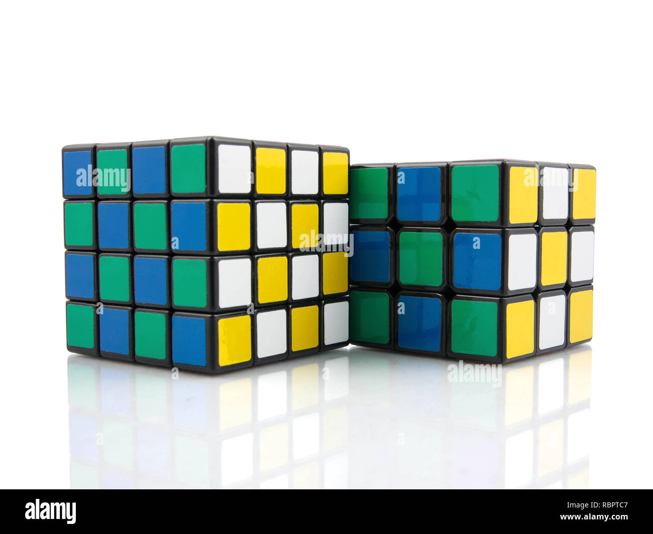 Two puzzle cubes on the white background Stock Photo - Alamy