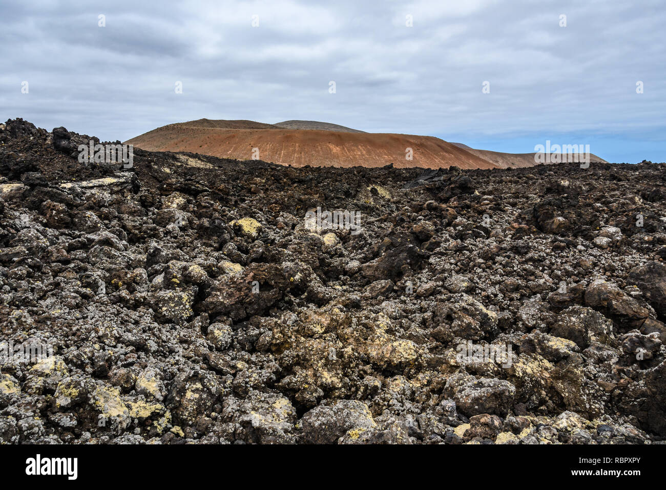 Black lava in the volcanic Timanfaya National Park, Lanzarote, Spain ...