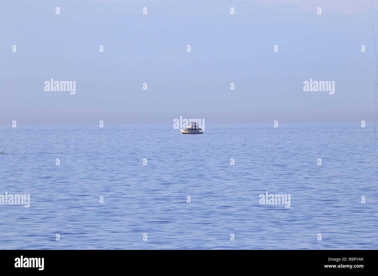 Distant boat hi-res stock photography and images - Alamy