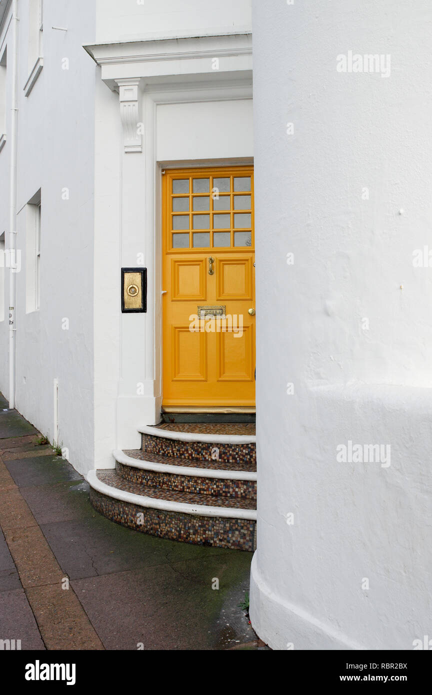 Striking yellow door in Brighton, East Sussex Stock Photo - Alamy