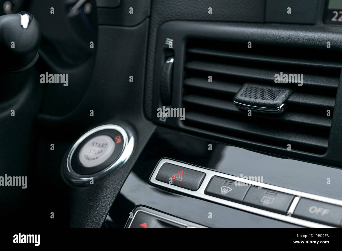 Car hazard warning flashers and emergency button with visible red ...