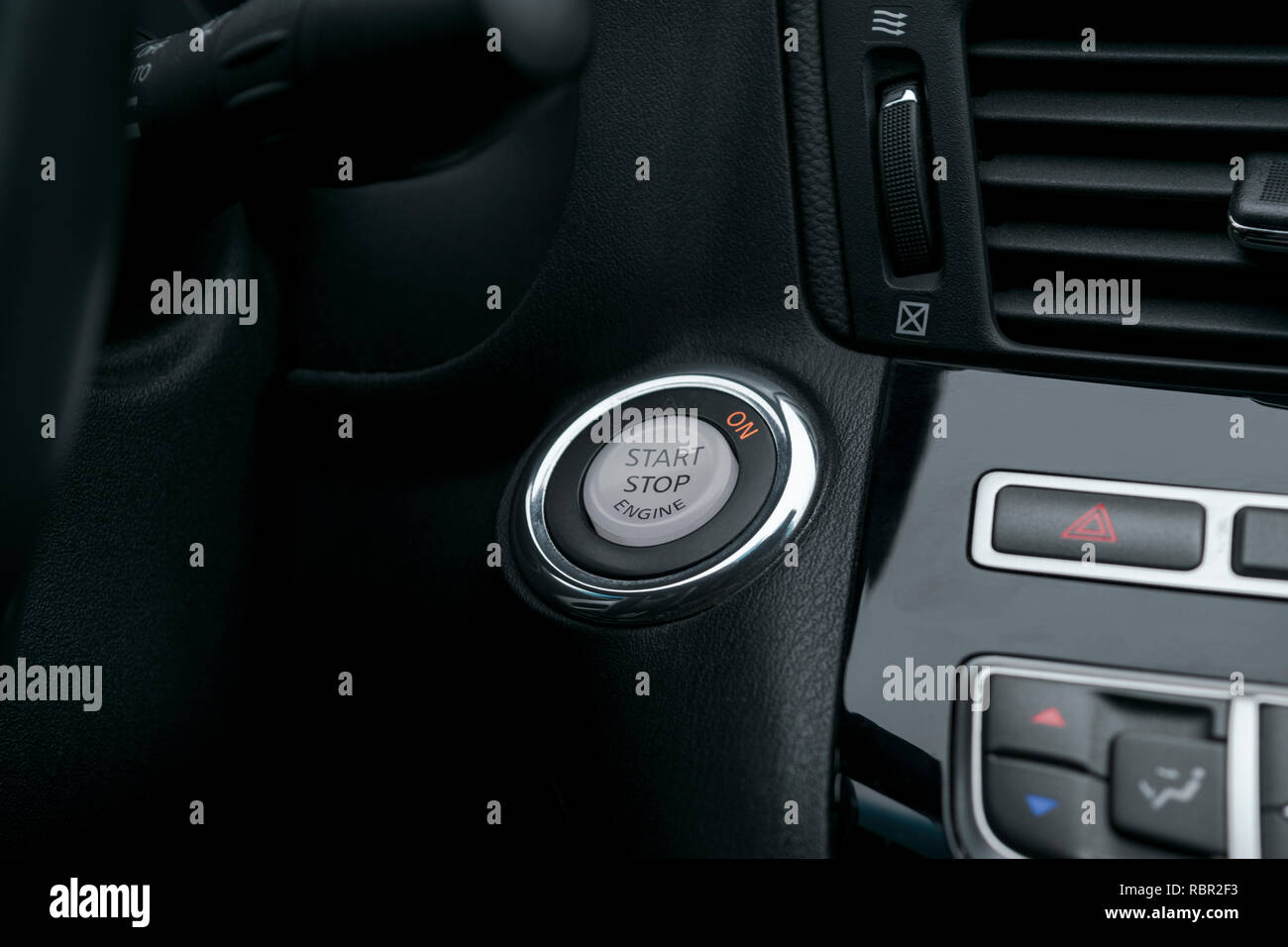 Car dashboard with focus on engine start stop button, Modern car ...