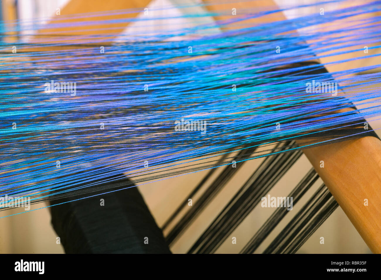 Close-up of the cotton warp in the double-back beam, that is a double ...
