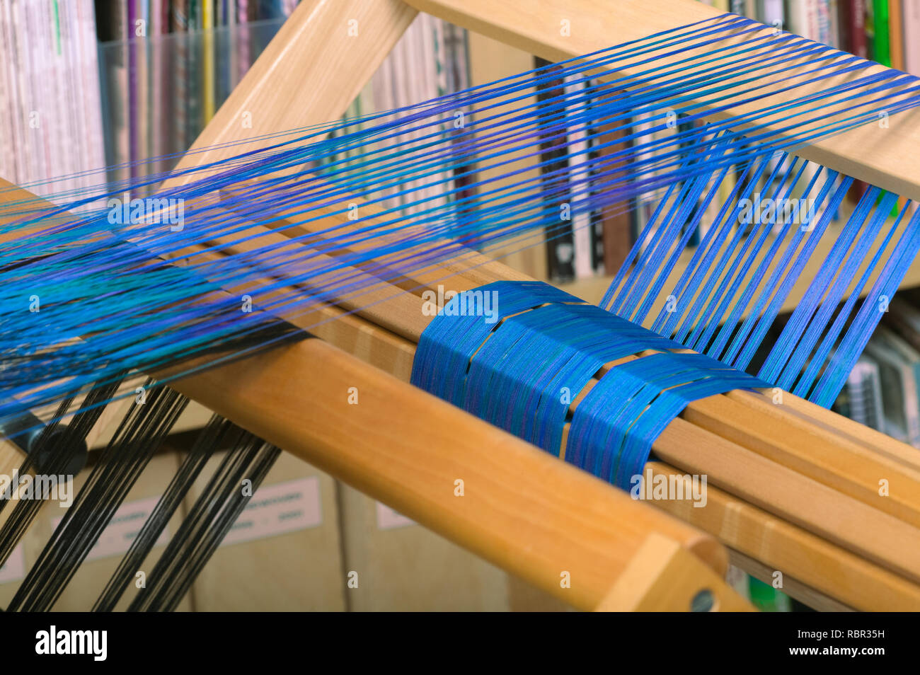 Close-up of the cotton warp in the double-back beam, that is a double ...