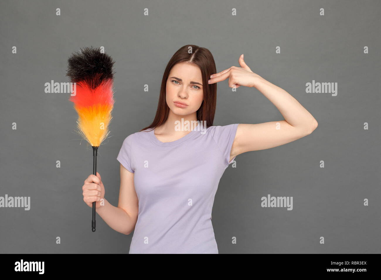Woman pointing finger head gun hi-res stock photography and images - Alamy