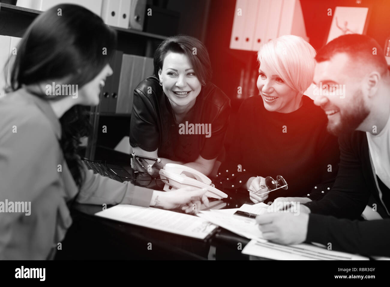 Smiling employees talking in workplace Stock Photo - Alamy